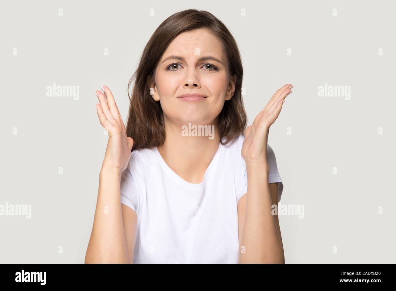 Millennial woman expressing disappointment asking for forgiveness ...