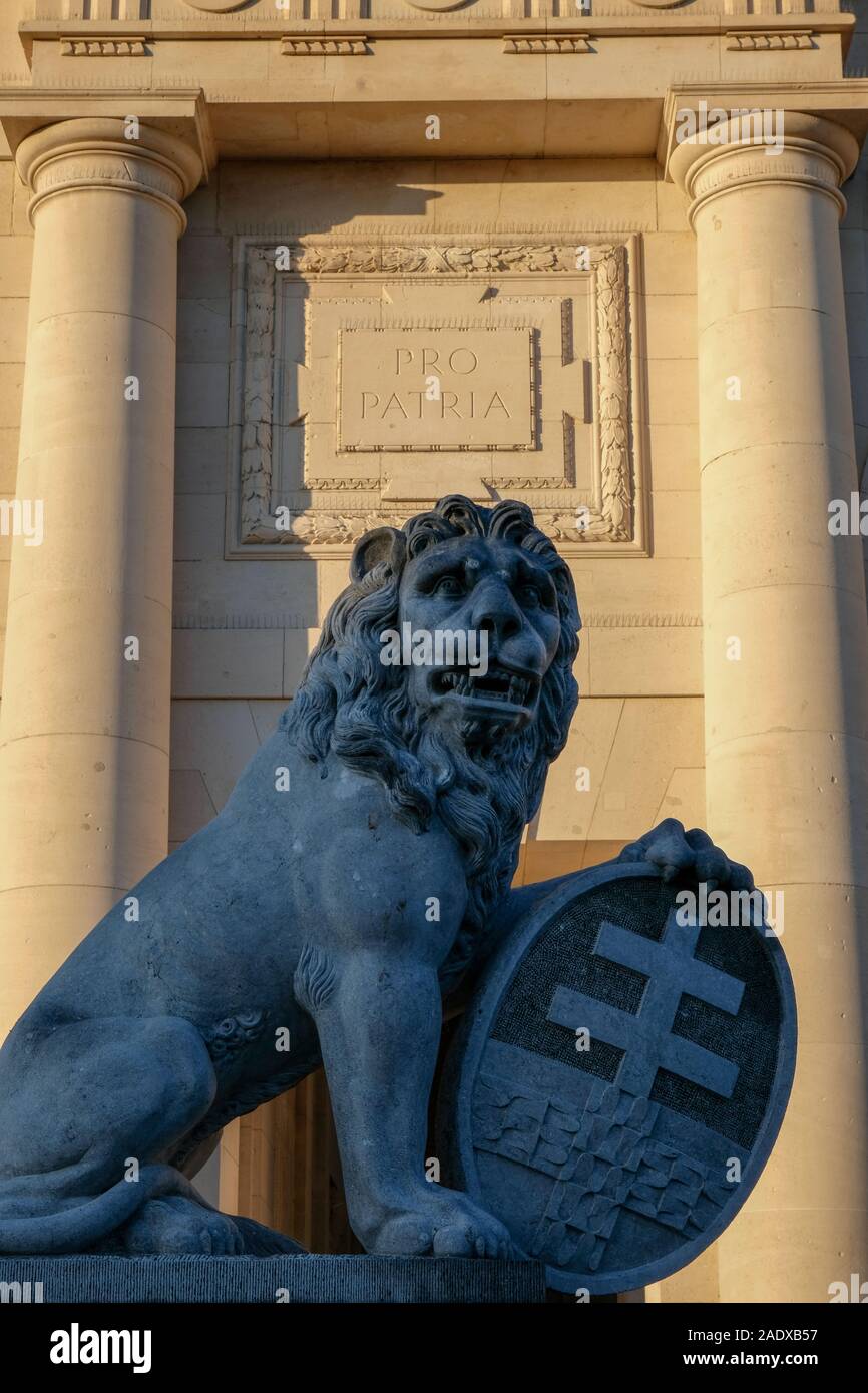 One of the lion statues in front of the Menin Gate Memorial to the ...