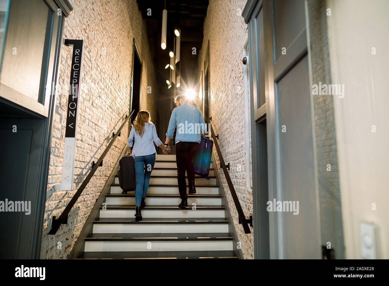 Couple going up stairs hi-res stock photography and images - Alamy
