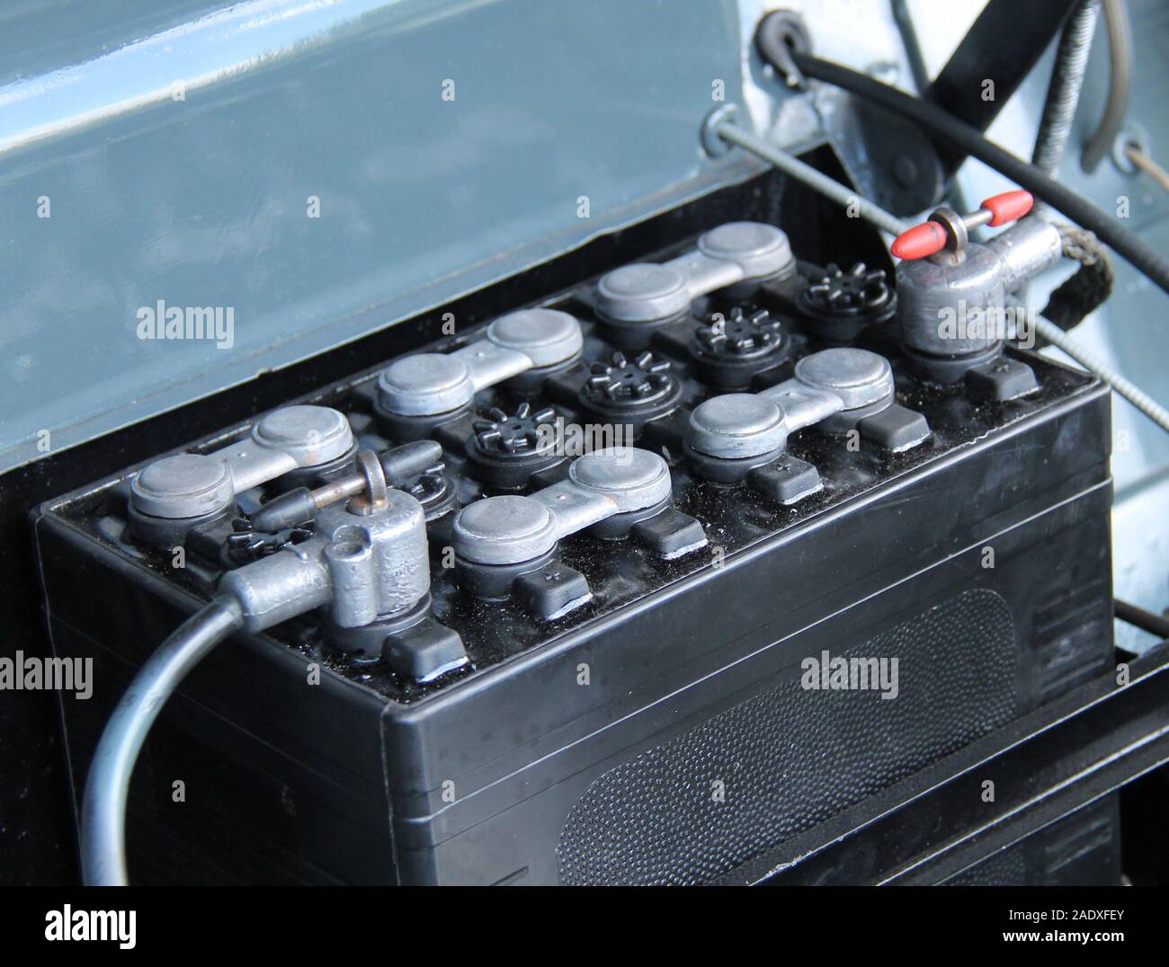 A Car Engine Battery in a Vintage Vehicle Stock Photo - Alamy