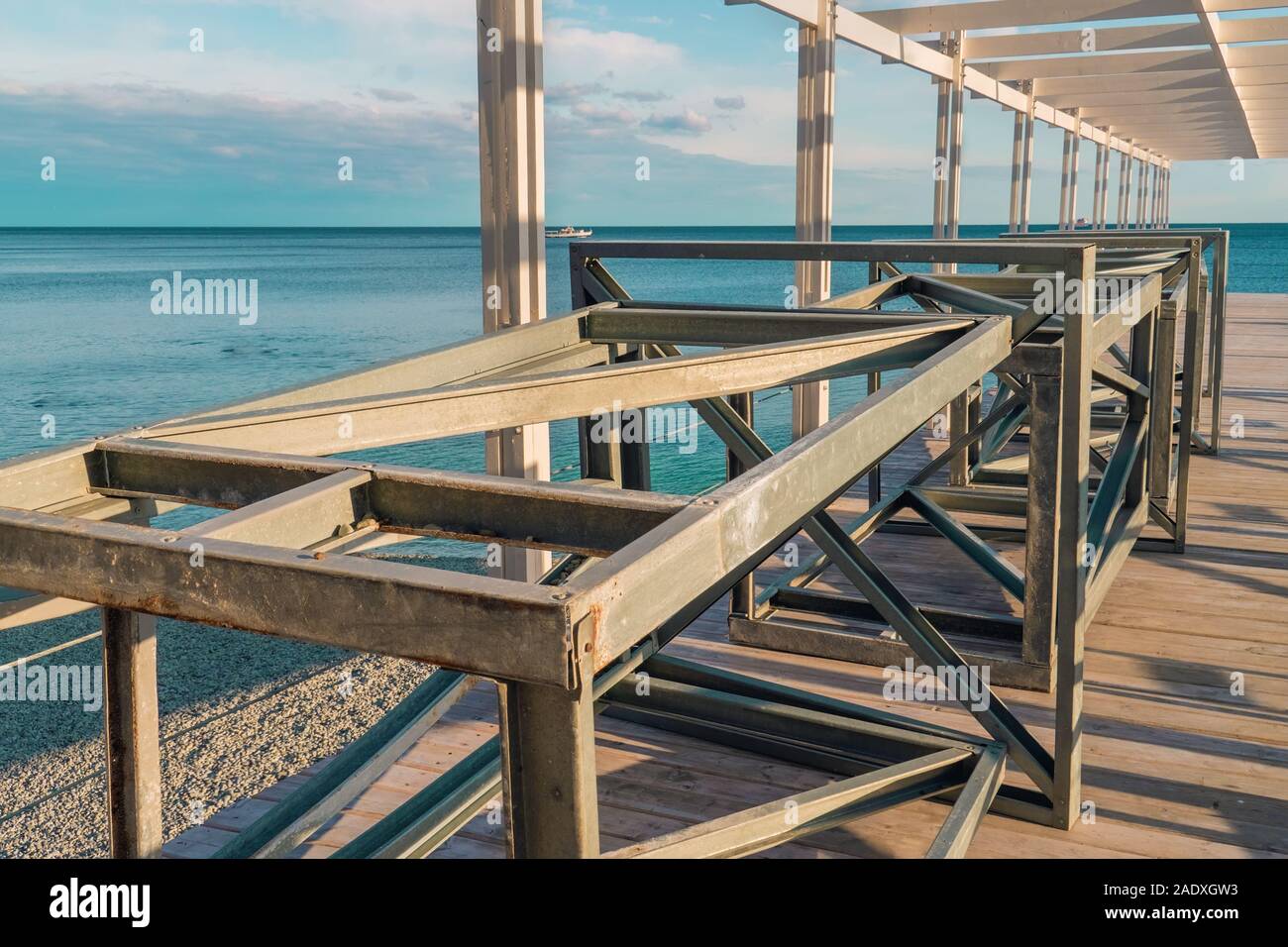 Metal structures on the shoreline for shelter from the sun. View of the ...