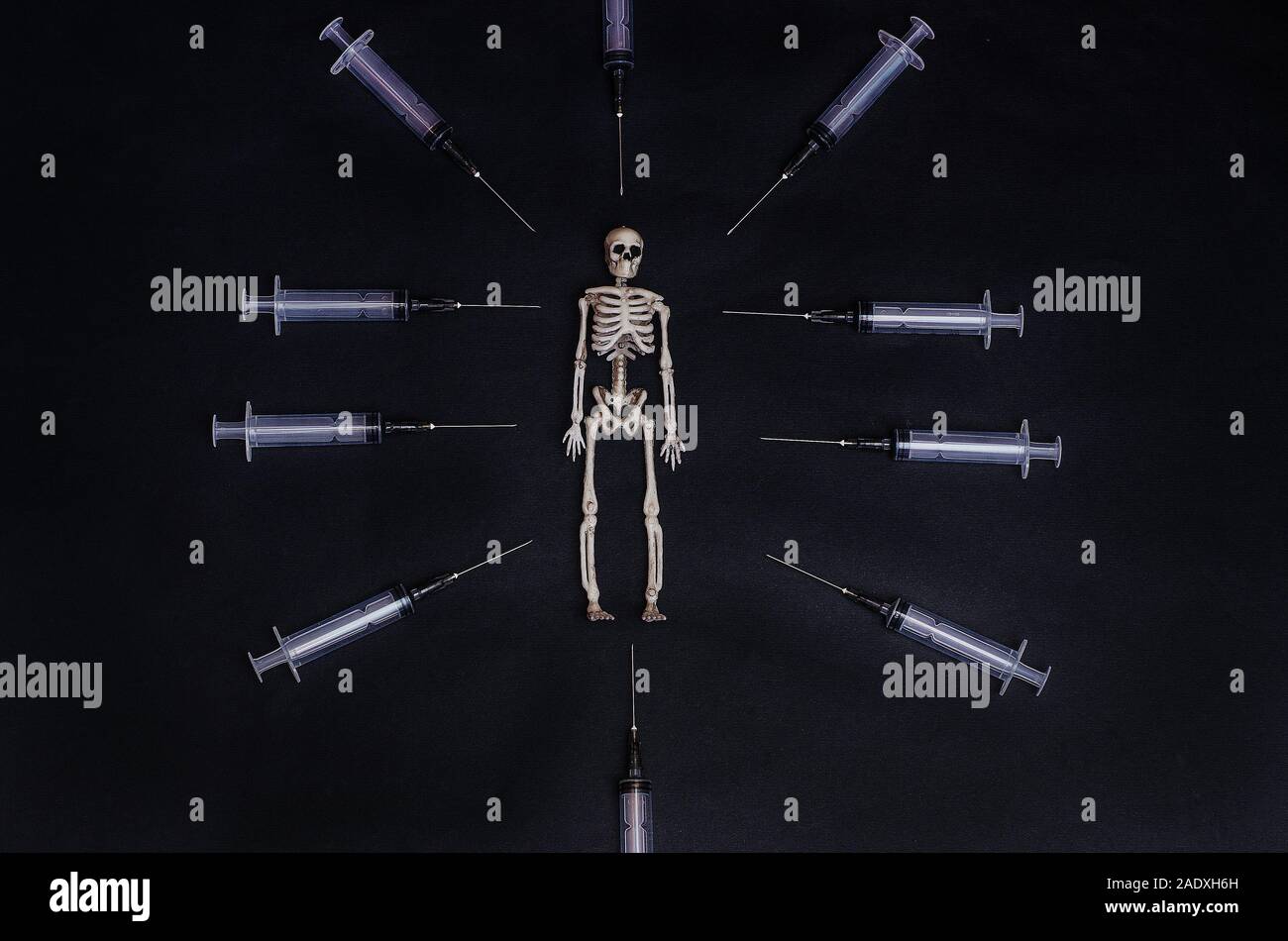 Social advertisement. Death from drugs. Skeleton on a black background ...