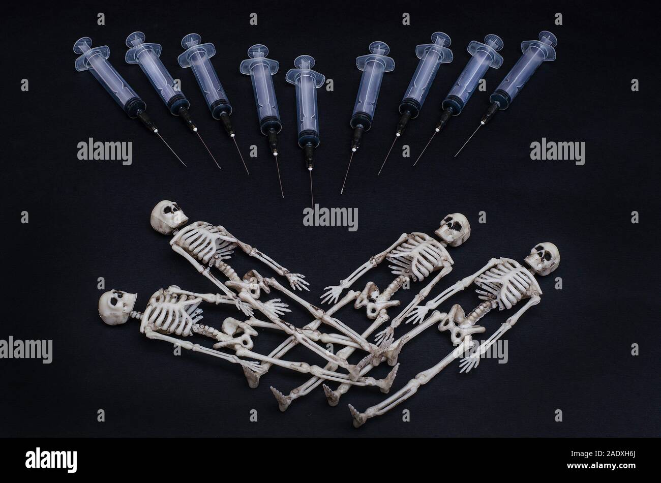 Social advertisement. Death from drugs. Skeletons on a black background ...