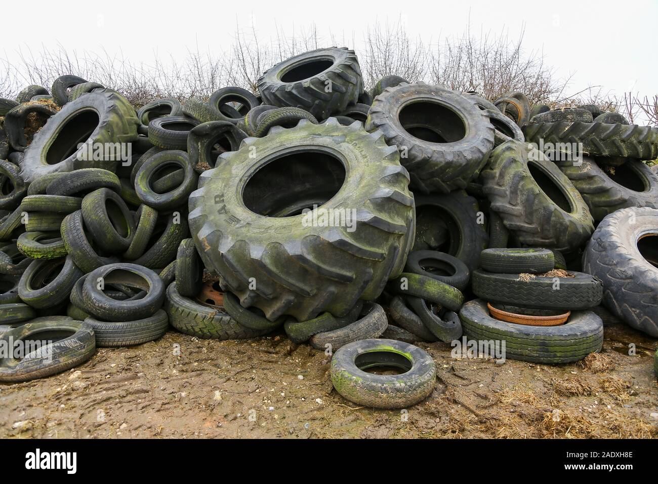Old vehicle tyres on a farm, England, UK Stock Photo - Alamy