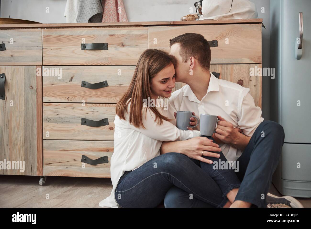 Let's keep it secret. Husband with his wife relaxing by sitting on the ...