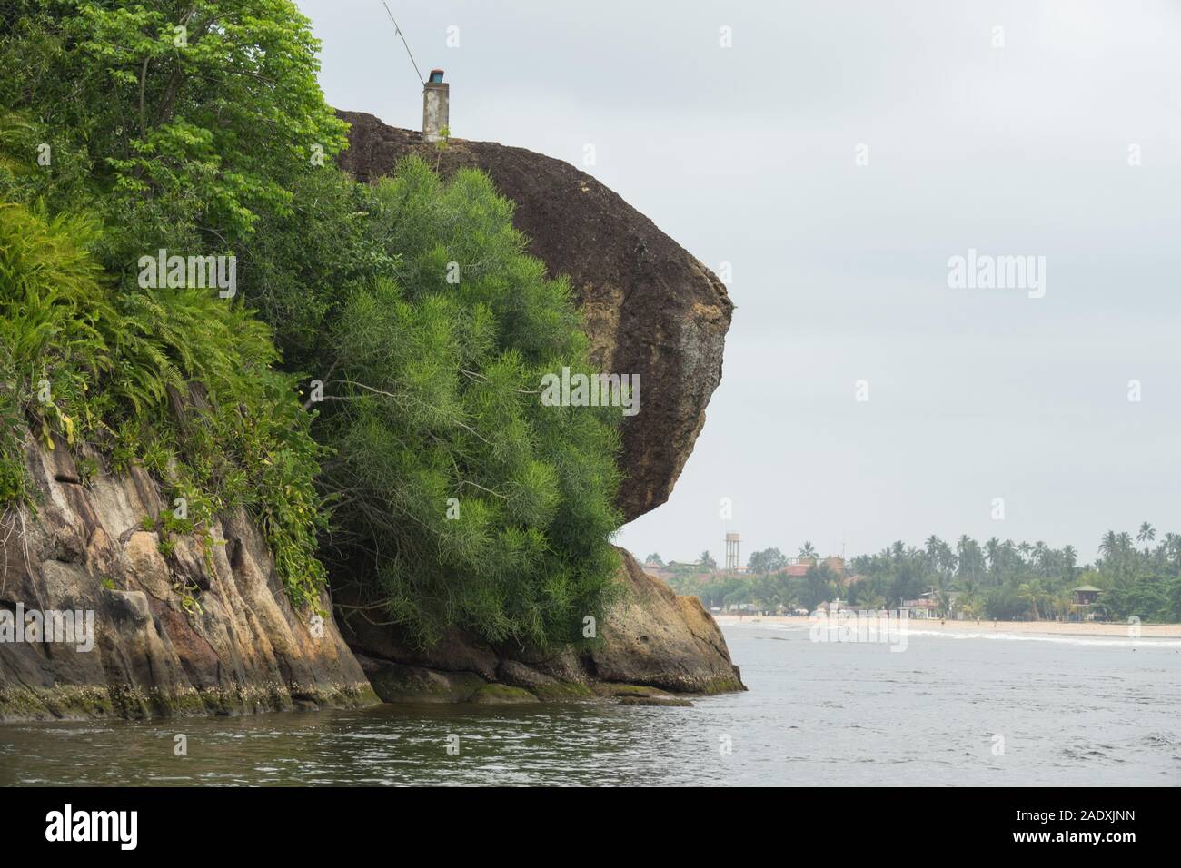 Island with a Buddhist temple, the city of Bentota in southwest Sri ...