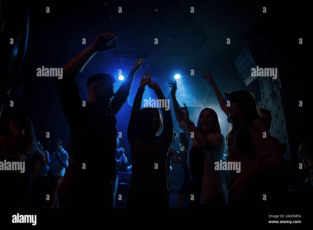 Energetic crowd. Group of people that enjoying dancing in the nightclub ...