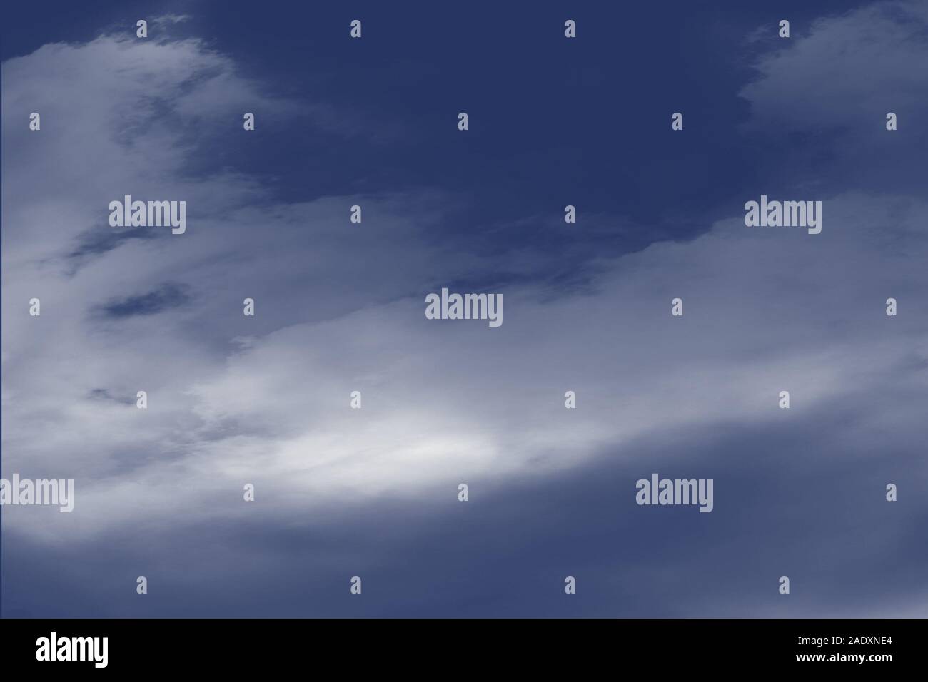 Silver clouds on the blue background Stock Photo - Alamy