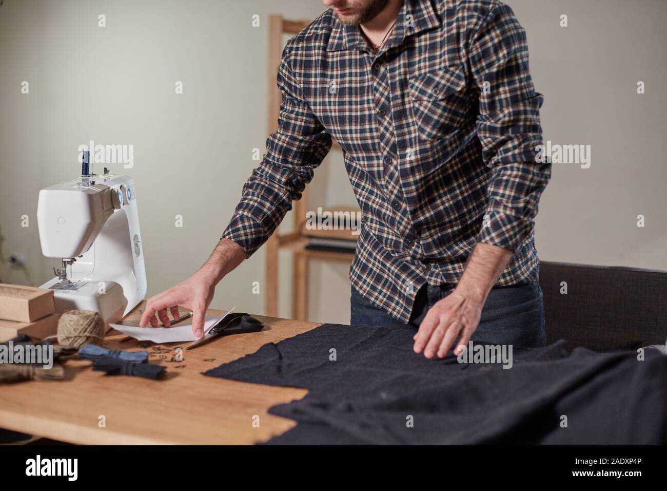 Tailor cutting wool fabric. the line pattern. Craftsman Makes ...