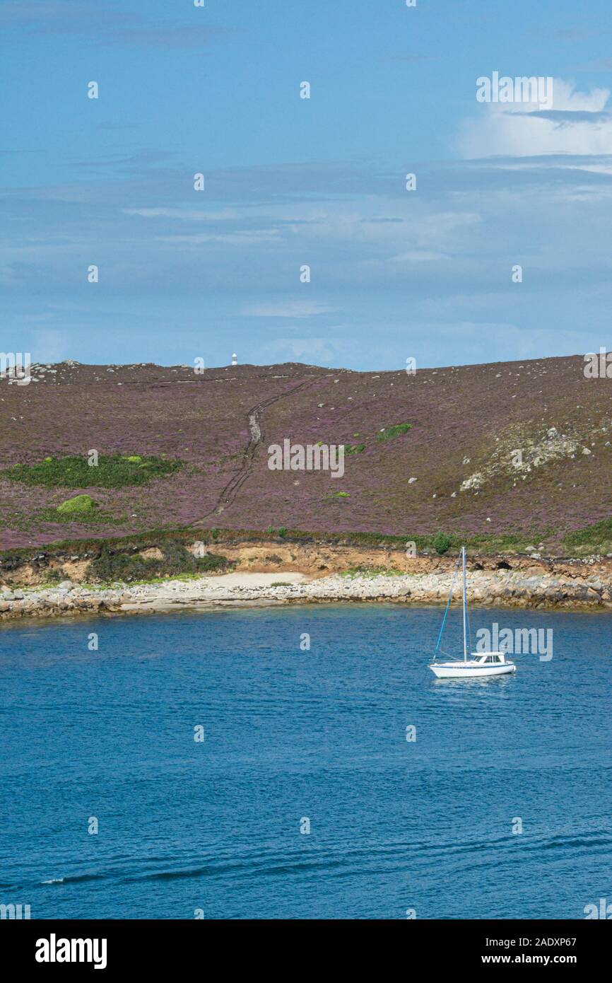 A boat between the islands of Bryher and Tresco in the Isles of Scilly ...