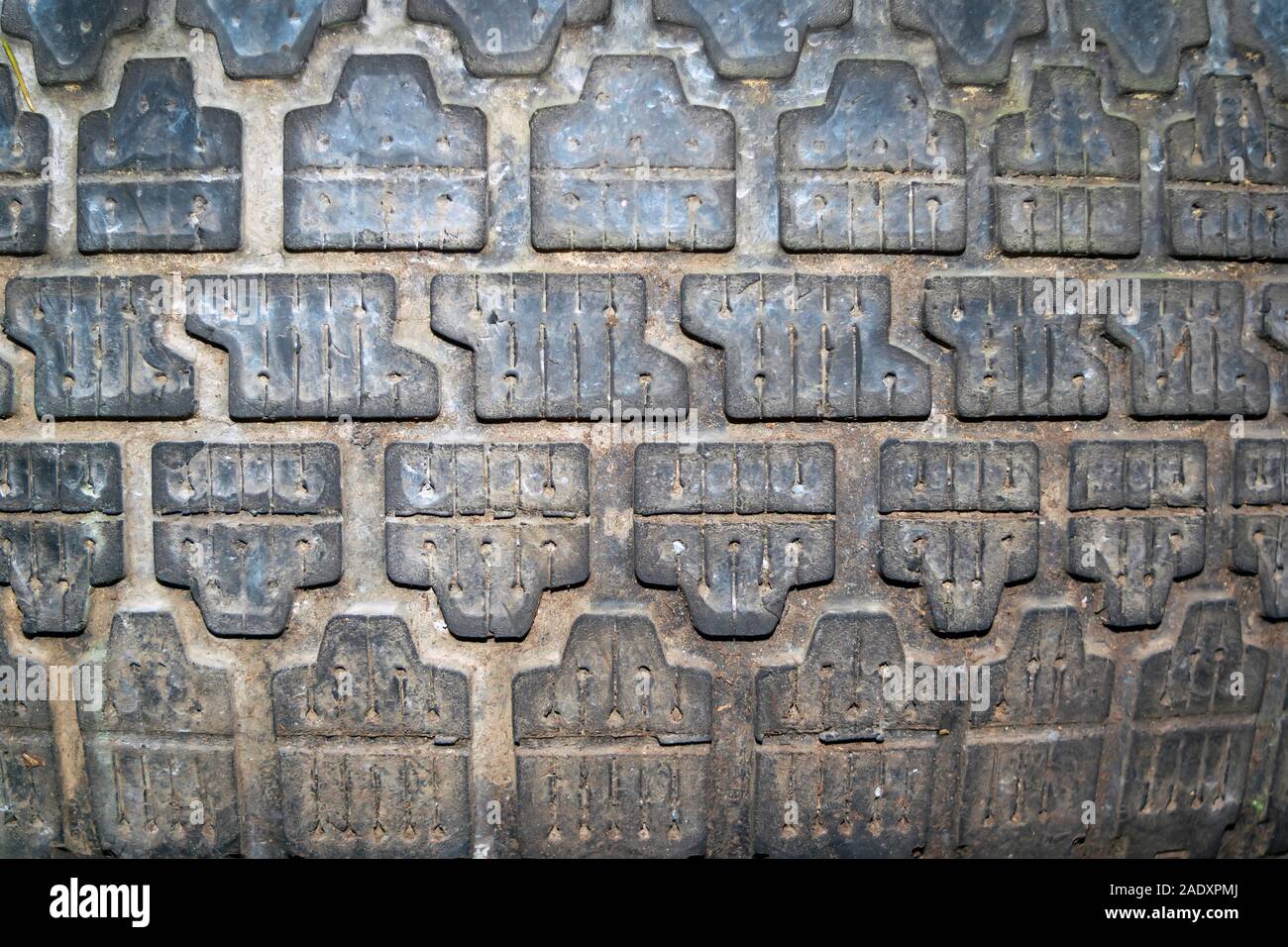 Old car worn tire with a worn tread Stock Photo - Alamy