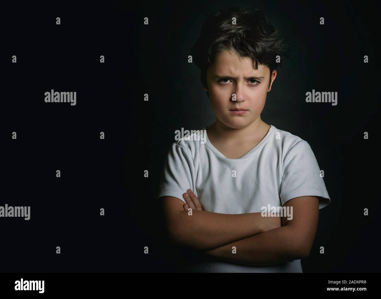 angry child on black background Stock Photo - Alamy