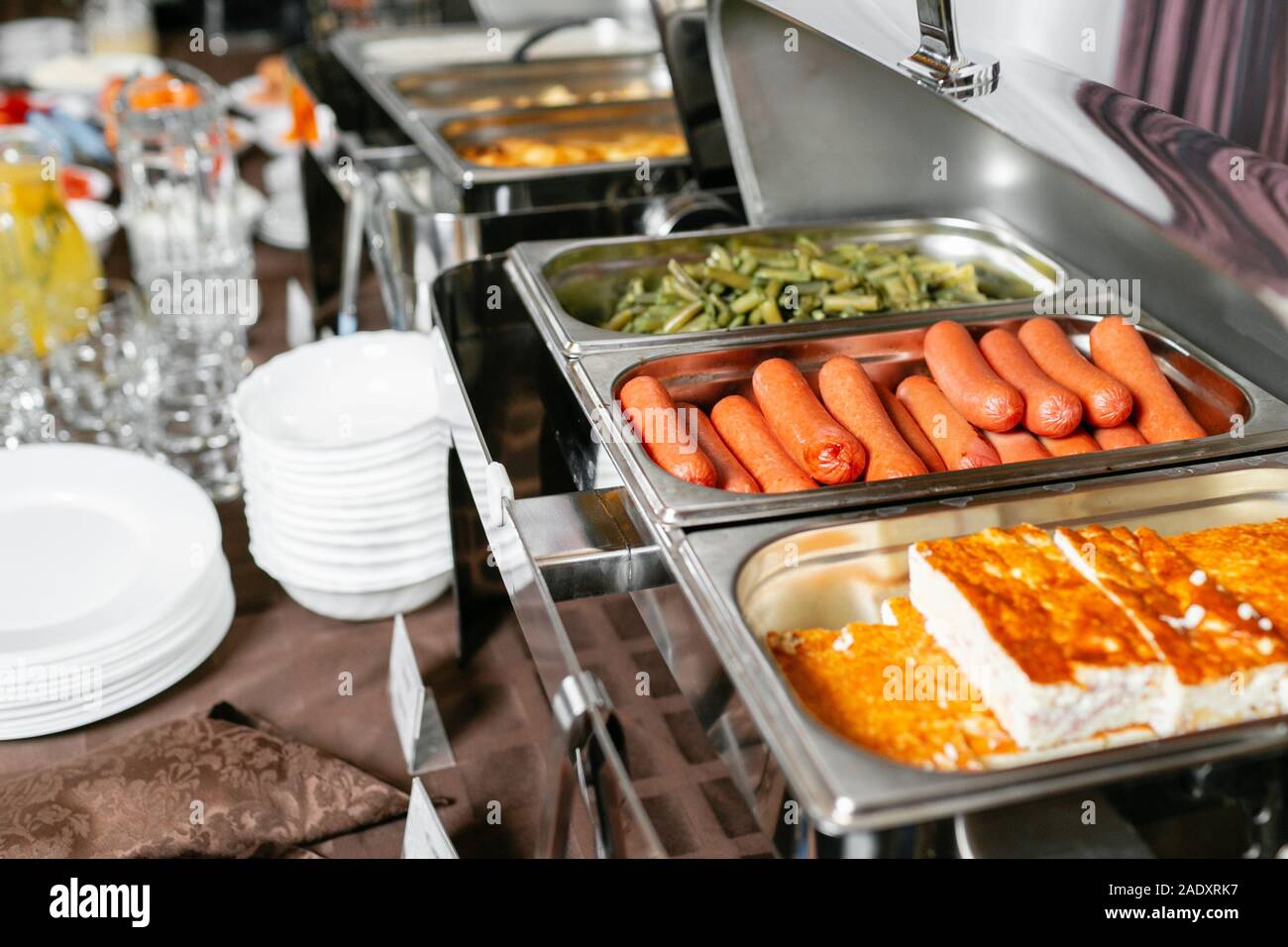 Breakfast buffet in hotel. Lots of heated trays ready for service ...