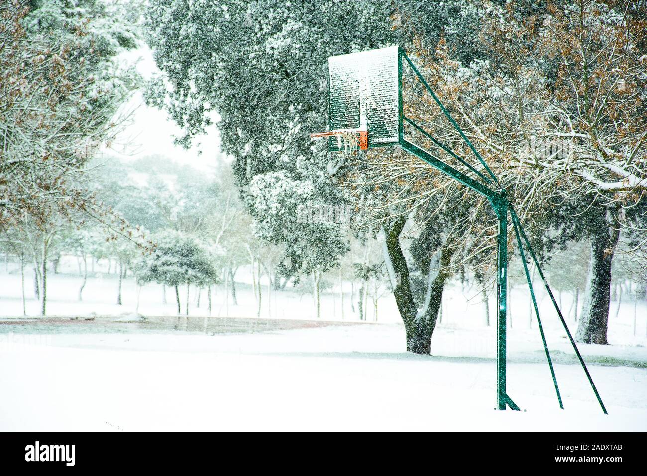 Basketball basket in snowy field Stock Photo - Alamy