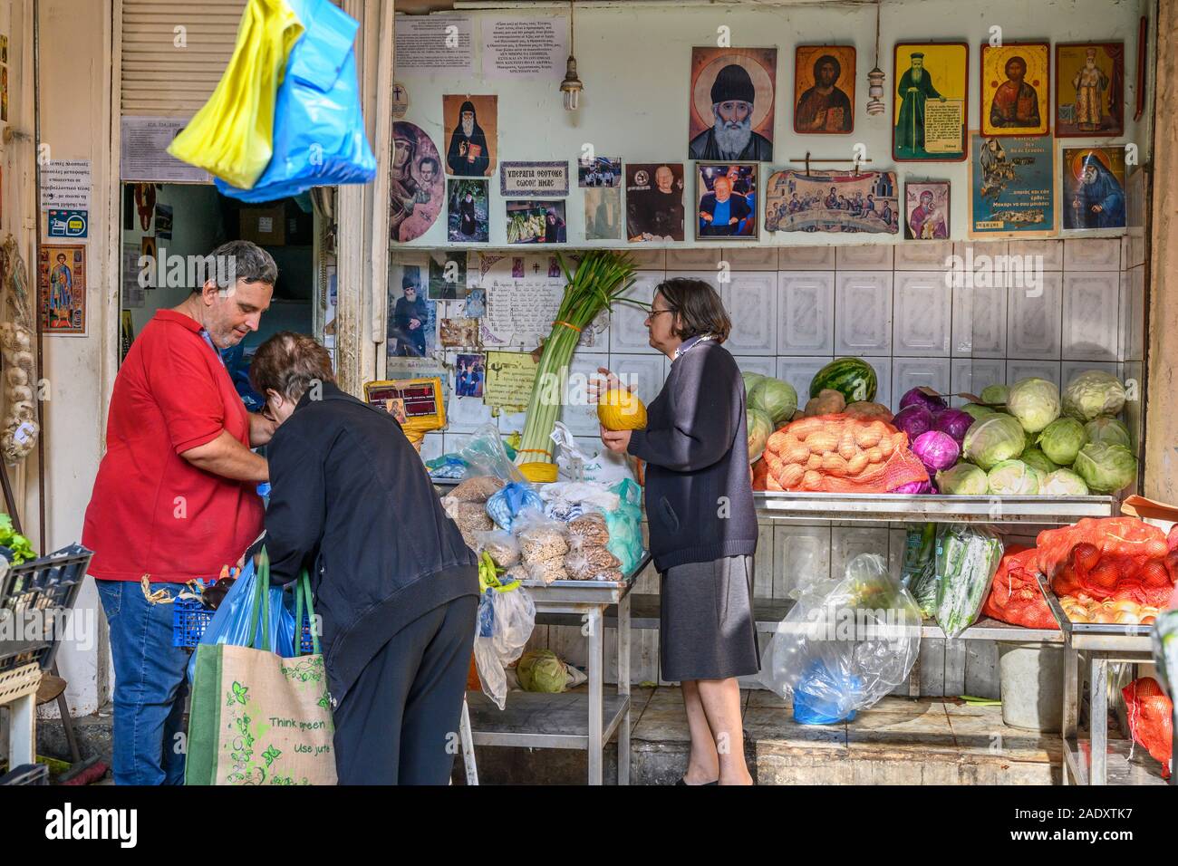 A fruit and vegetable stall decorated with religious icons at Modiano ...