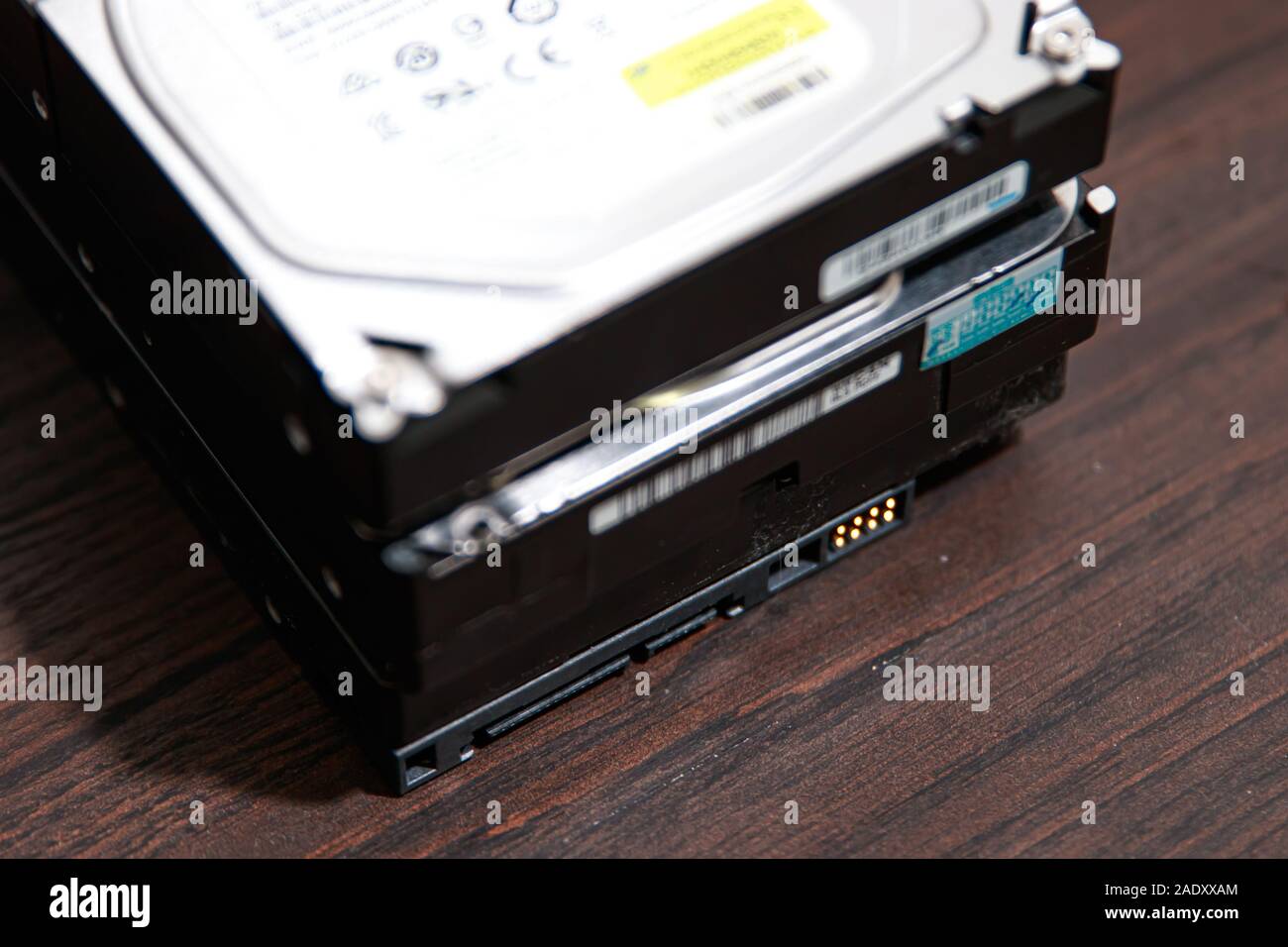 Pile of Hard Drive on wooden table Stock Photo - Alamy