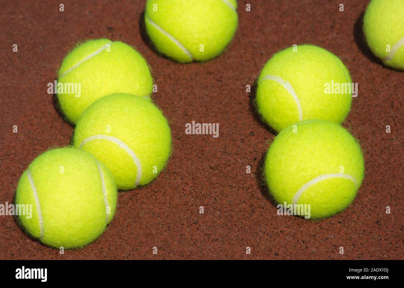 Seven yellow tennis balls near court marking side view close up Stock ...