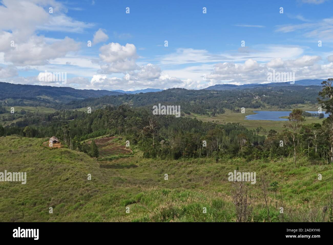 view over traditional farm to lake and mountains beyond Wapenamanda ...