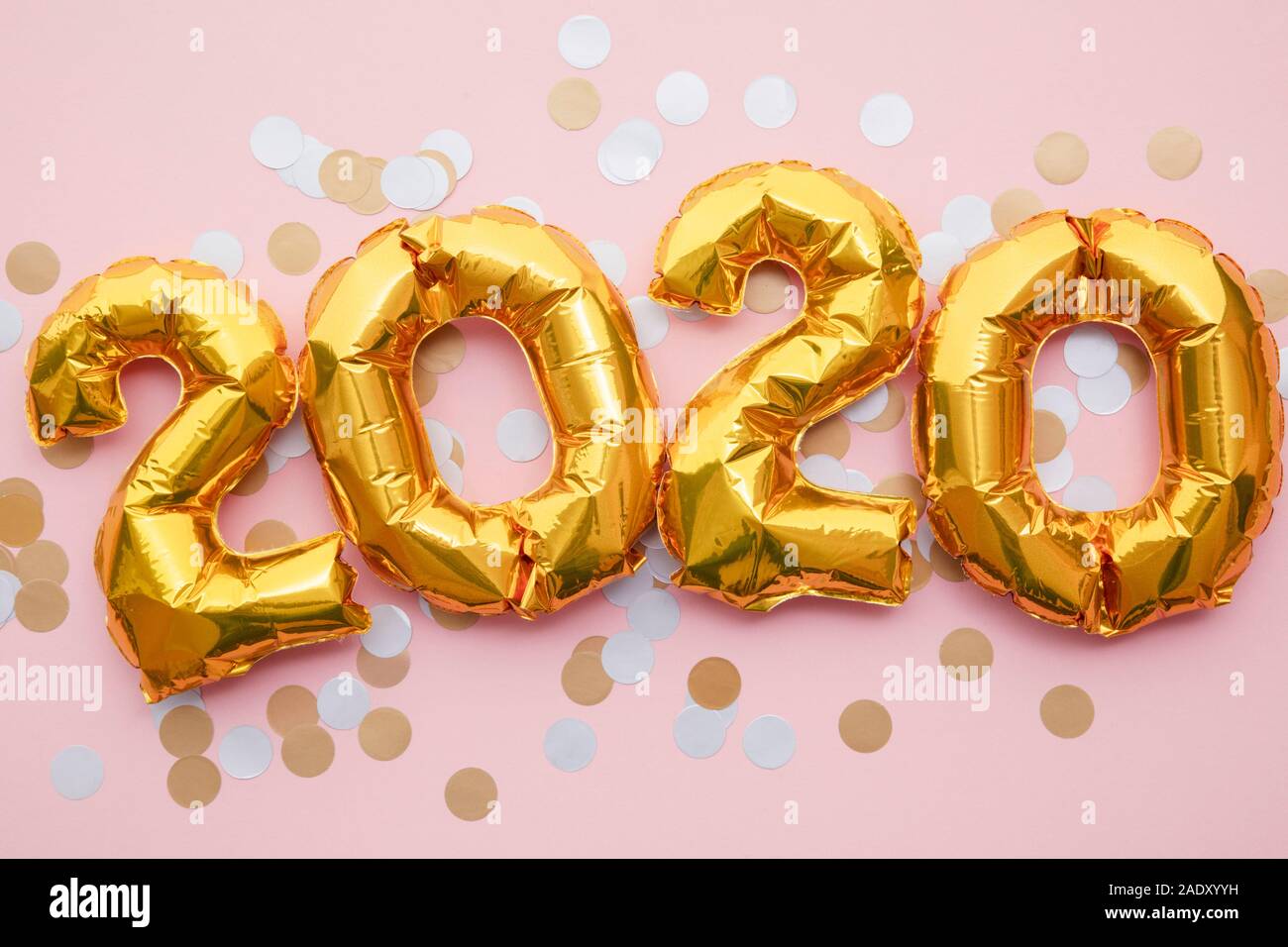 2020 New year party celebration. Gold foil party balloons with ...