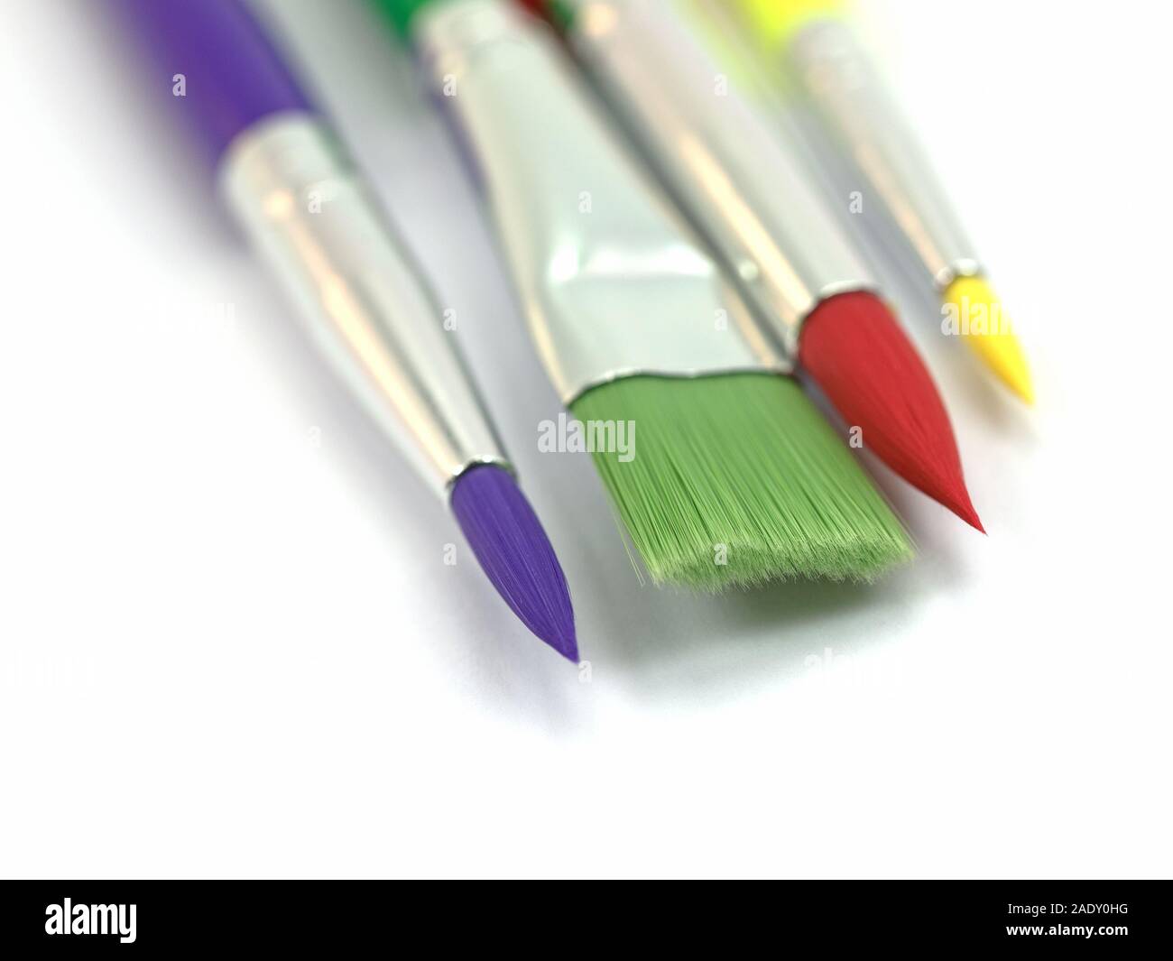 Artist brushes in front of white background Stock Photo - Alamy