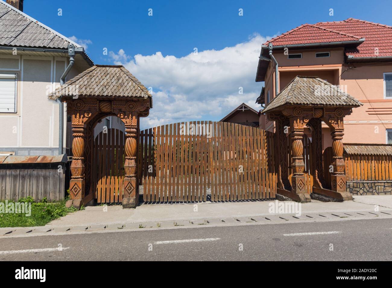 Traditional, wooden gates with different patterns in the village of ...