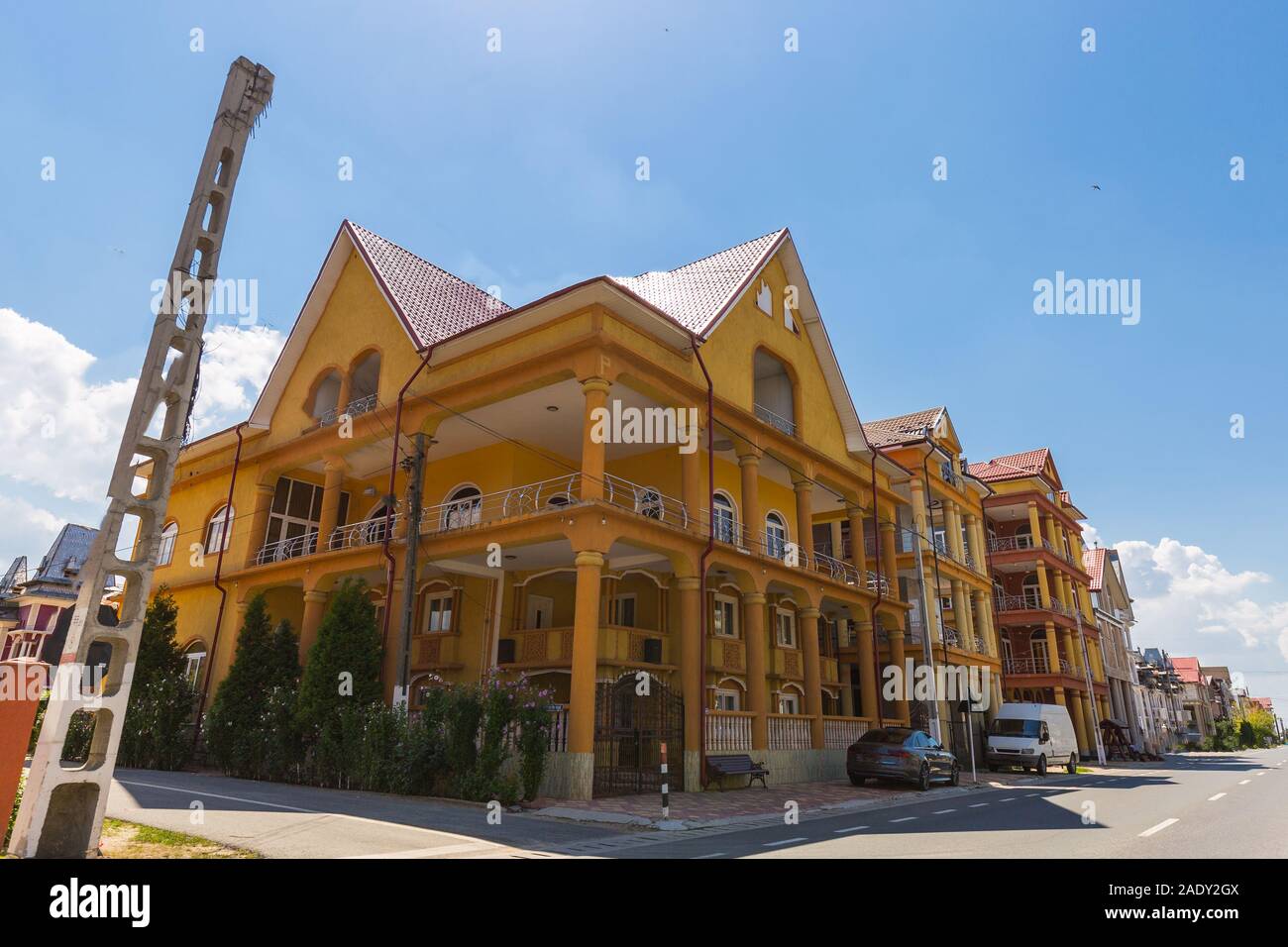 Residential buildings are made in different architectural styles on the ...