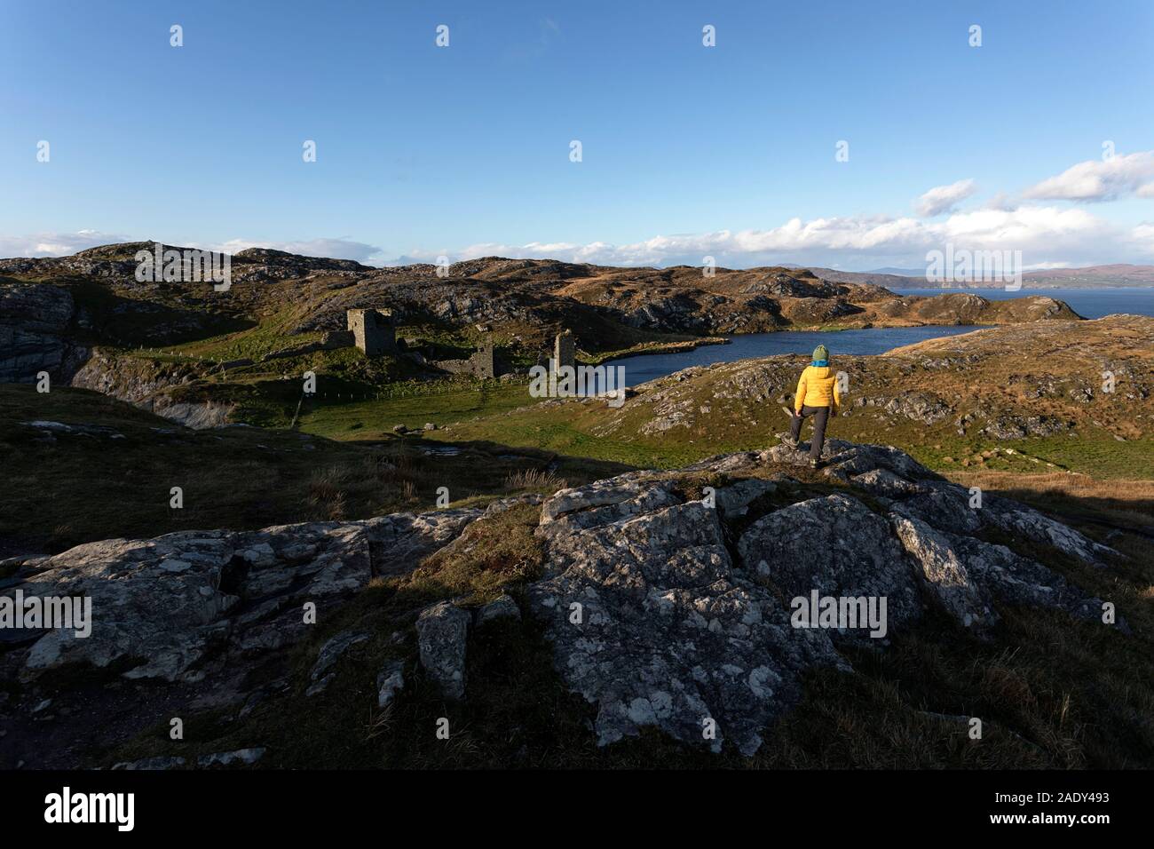 Young boy hiking to castle ruins, Scenic sight of Dunlough Castle ...
