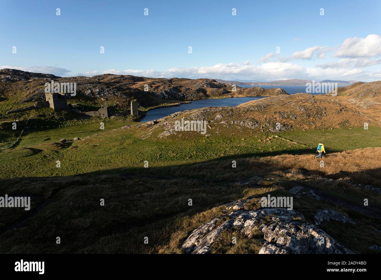 Mother and son hiking to castle ruins, Scenic sight of Dunlough Castle ...