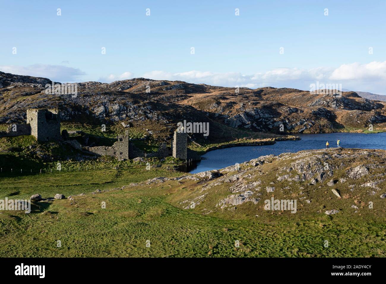 Mother and son hiking to castle ruins, Scenic sight of Dunlough Castle ...