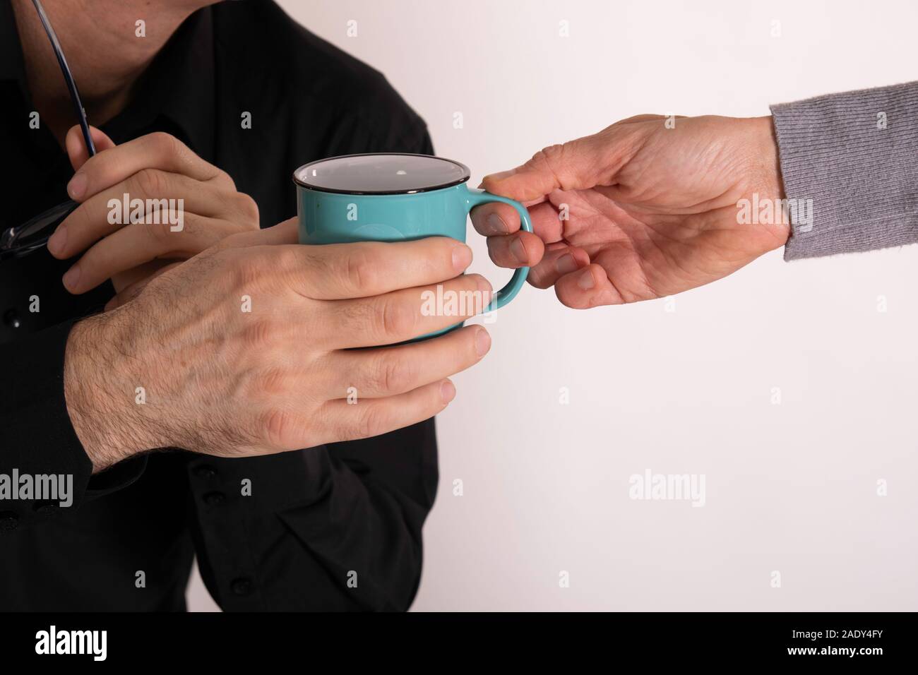 Woman giving tea office hi-res stock photography and images - Alamy