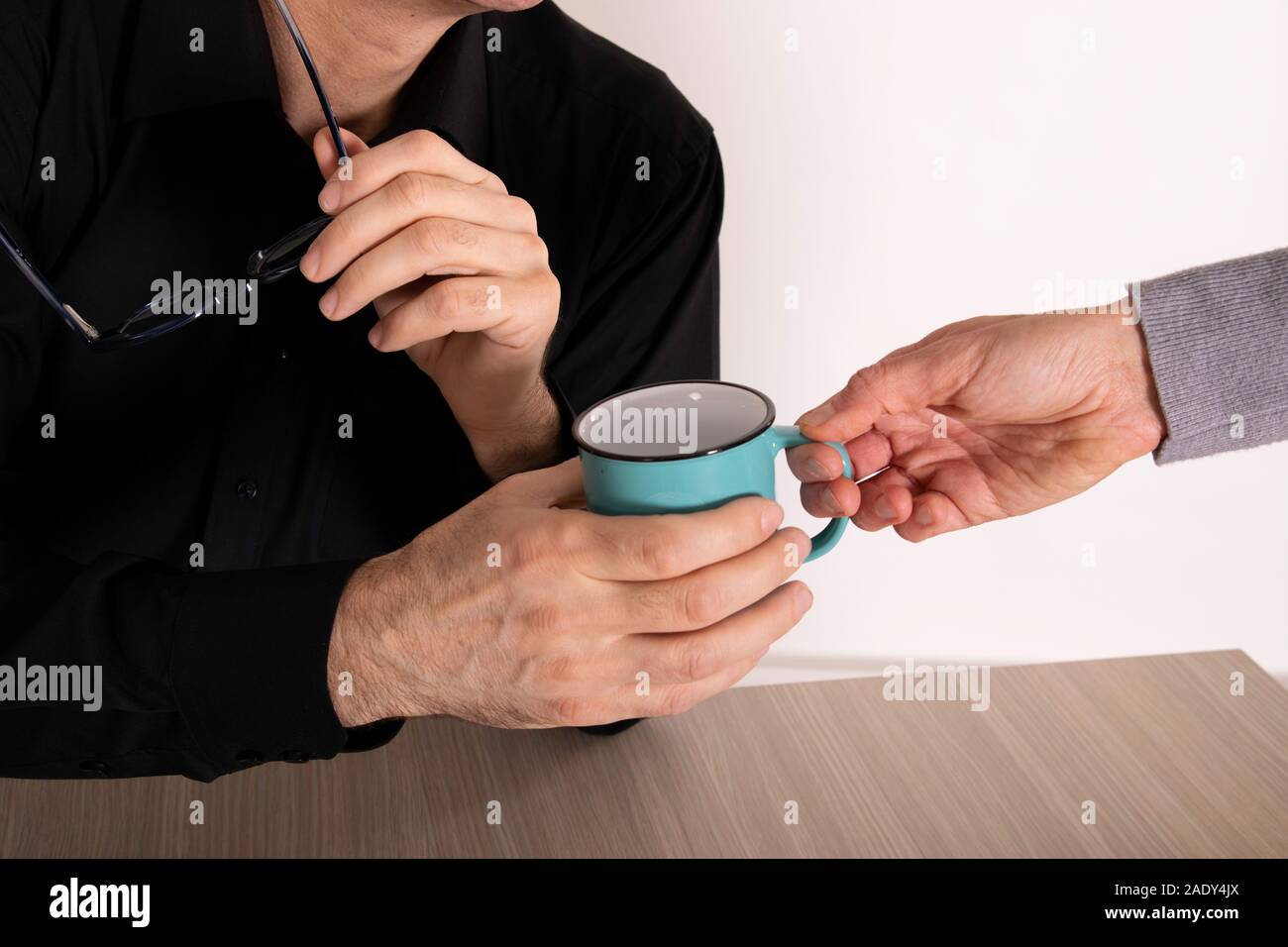 Woman giving tea office hi-res stock photography and images - Alamy