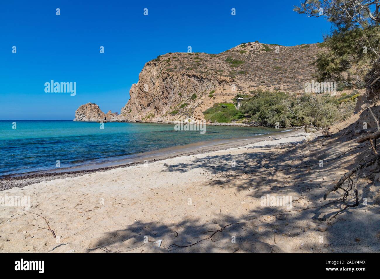 Plathiena beach with cliffs and vegetation, Milos, Greece Stock Photo ...