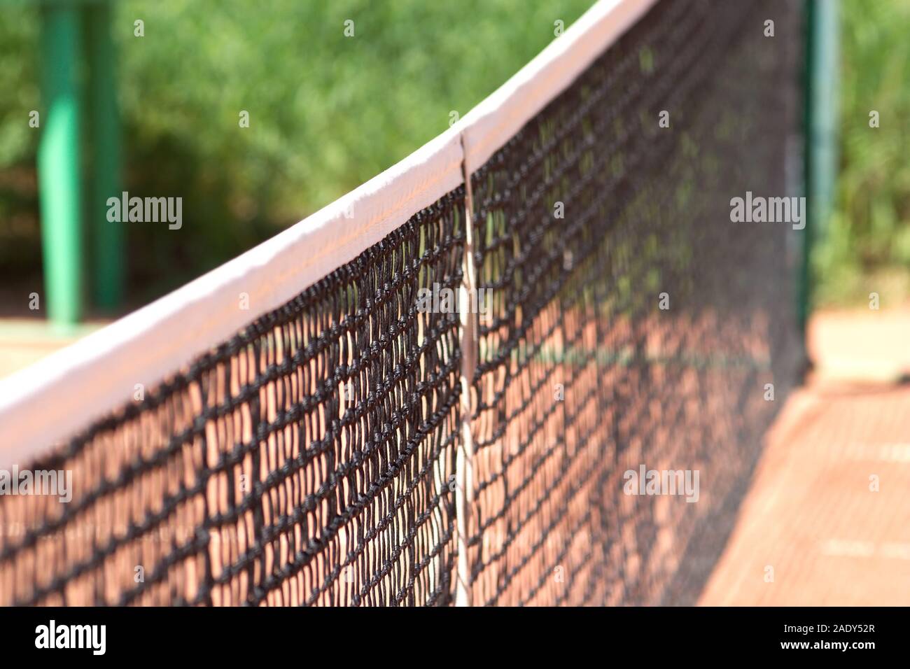 Tennis net on ground court on bright sunny day side view closeup Stock ...
