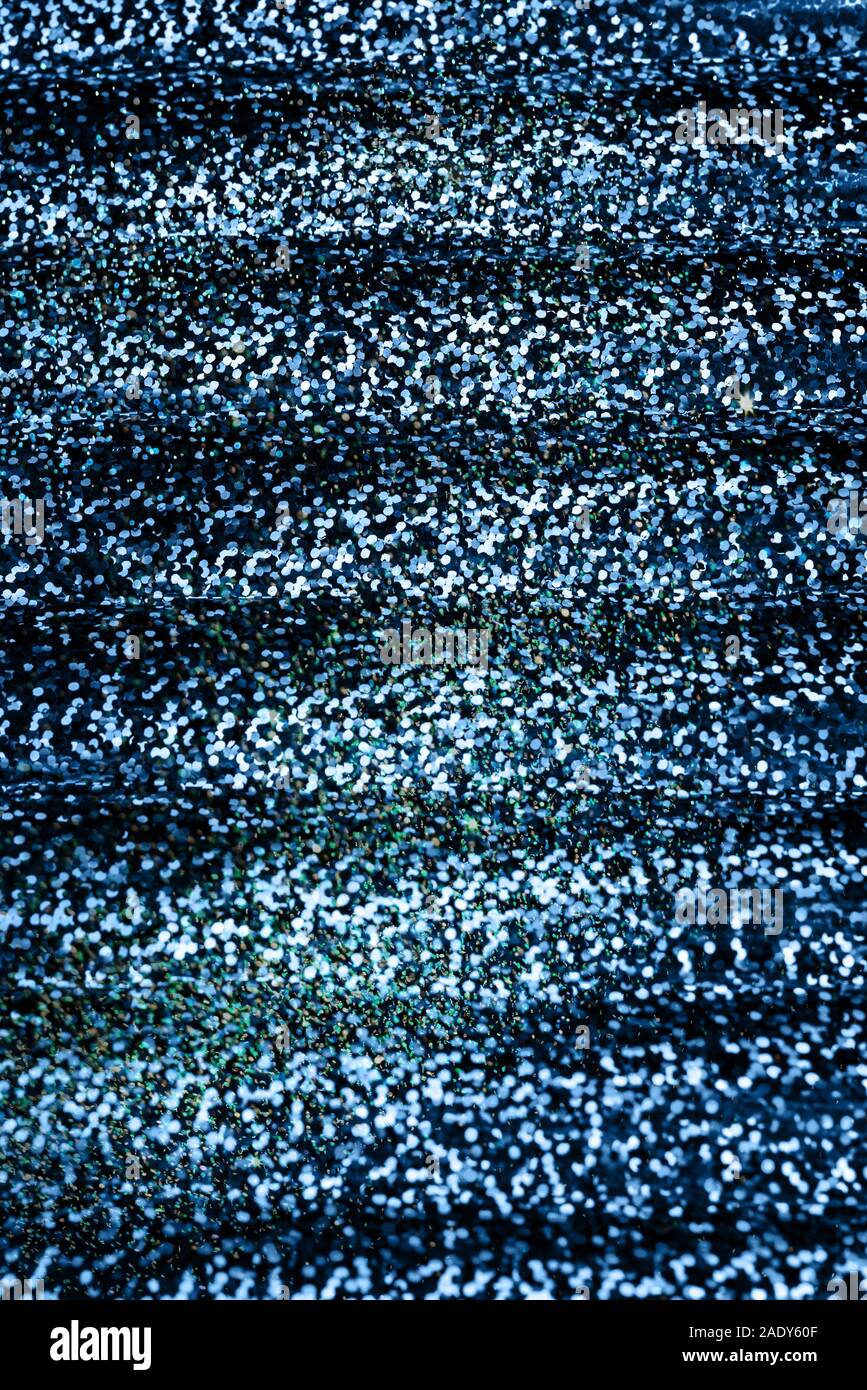 Photo of holographic real texture in blue colors, magic iridescent ...