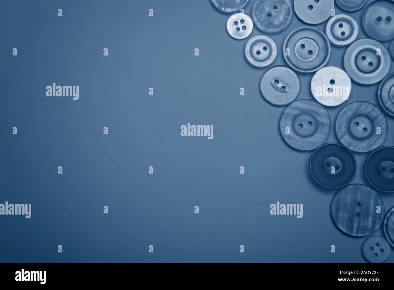 Buttons of different colors in blue tones. Flat lay Stock Photo - Alamy
