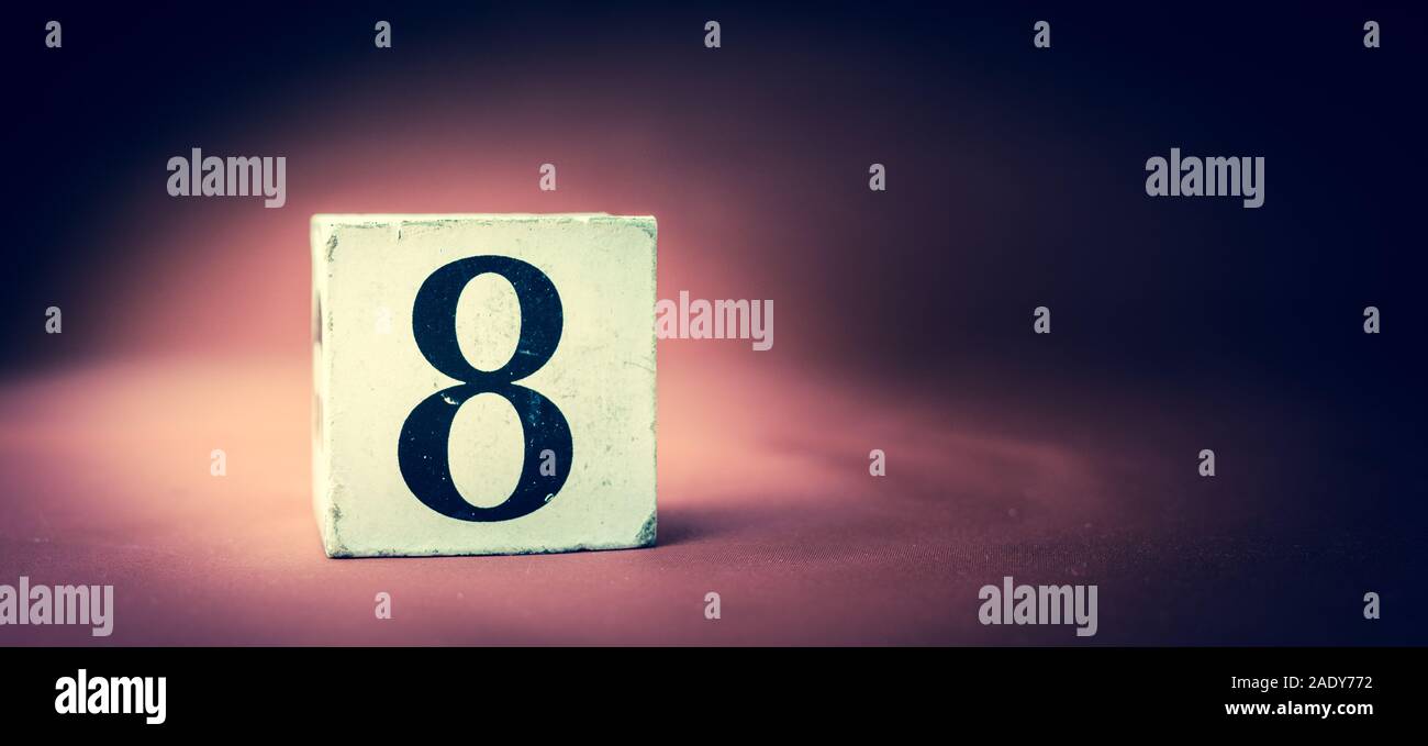 Old vintage wooden block with digit 8, number eight - vivid maroon ...