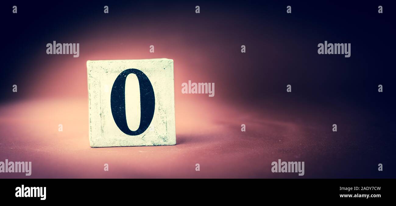 Old vintage wooden block with digit 0, number zero - vivid maroon ...