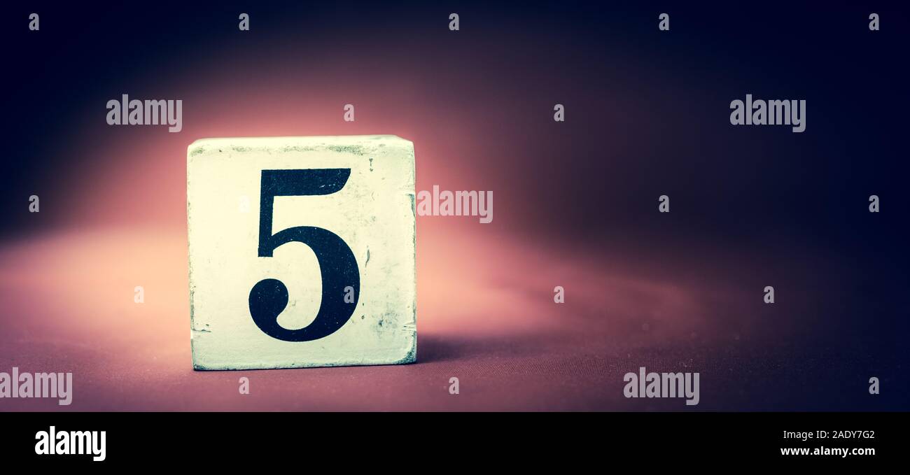 Old vintage wooden block with digit 5, number five - vivid maroon ...