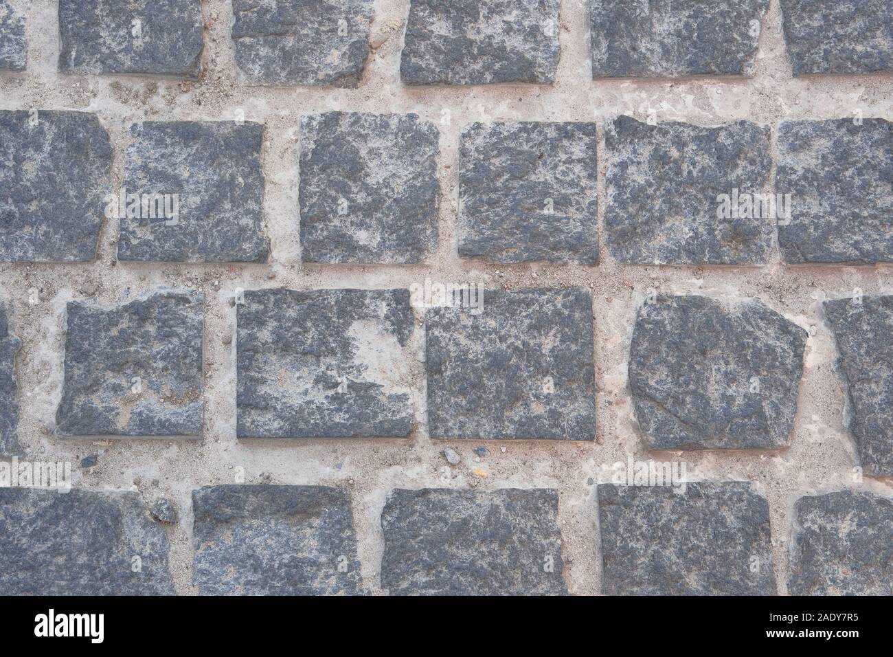 Pavement is lined with old stone. Gray retro stone texture. Ancient ...
