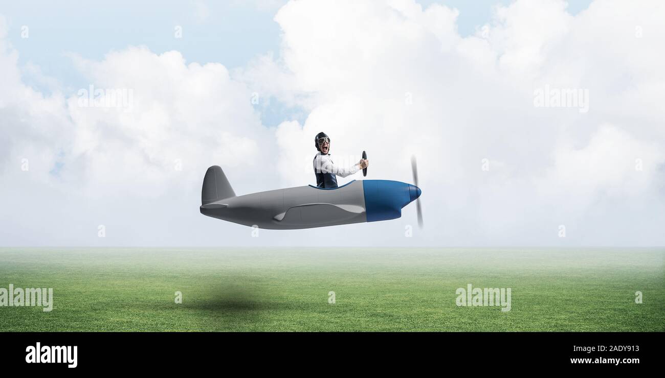 Happy aviator driving small propeller plane Stock Photo - Alamy