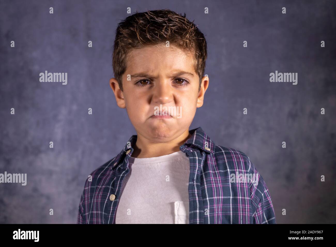 Angry child. Little boy with an angry expression Stock Photo - Alamy