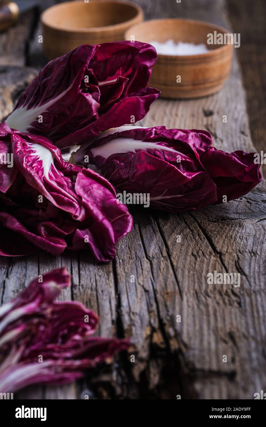 Fresh baby radicchio on wooden board. Healthy vegan plant based food on ...