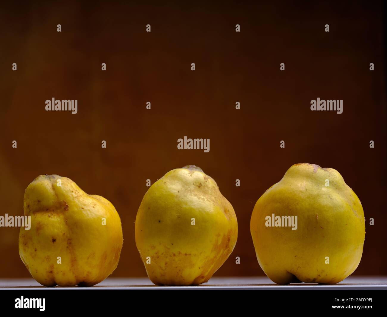 Three very different organic lemons very high resolution on a red ...