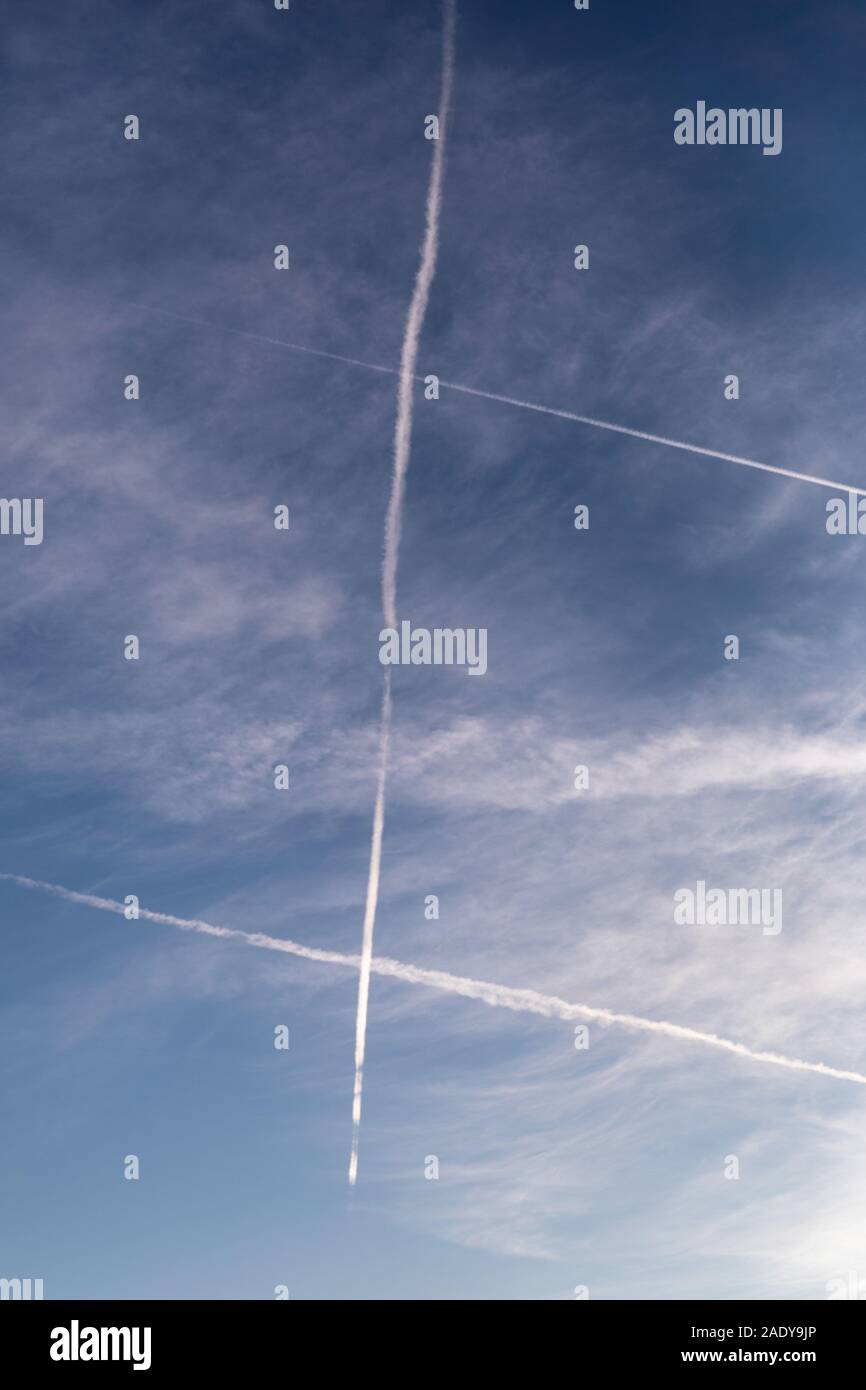 Airplanes crossing paths on blue German sky Stock Photo - Alamy