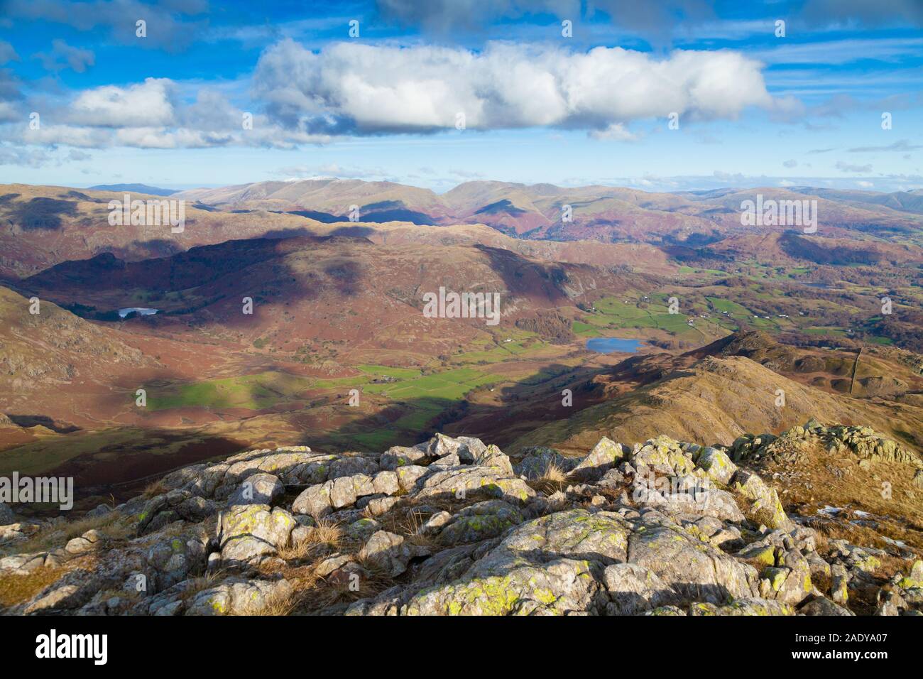 Looking down Wetherlam Edge to Little Langdale tarn and Helvellyn in ...