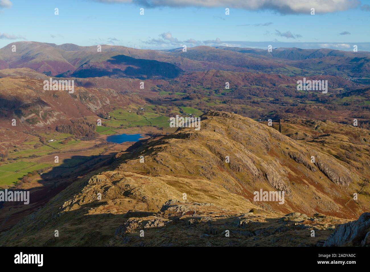 Looking down Wetherlam Edge to Little Langdale tarn Cumbria England ...