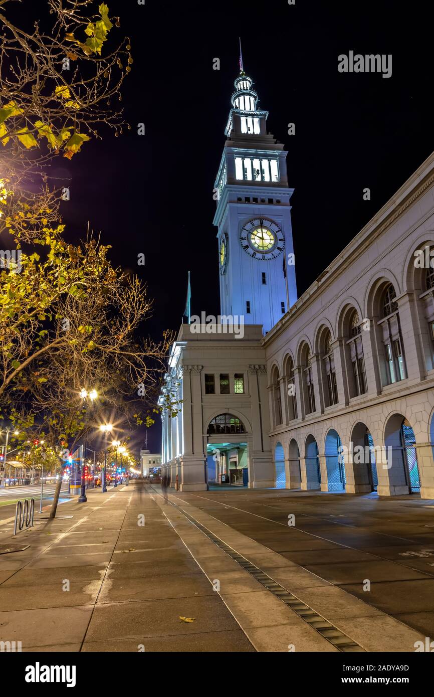 The San Francisco Ferry Building with the clock tower at night time ...