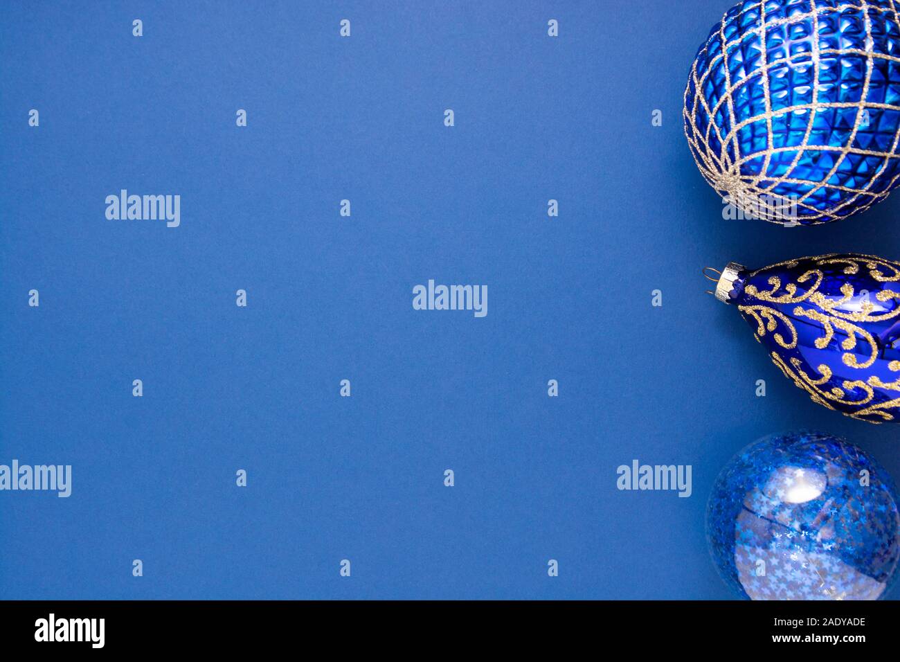 Christmas blue abstract background with blue baubles ornament over blue ...