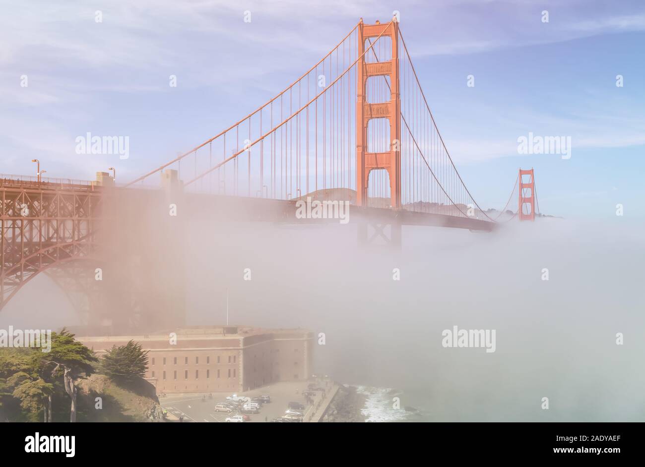 Thick low fog formed under the Golden Gate Bridge in San Francisco ...