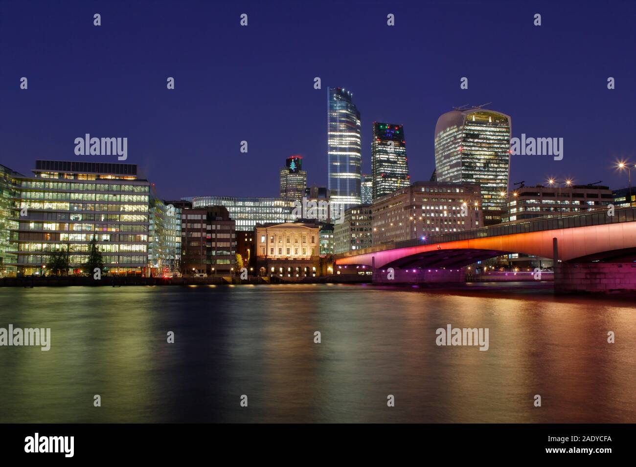 New London Bridge, River of Light lighting and the city skyscrapers ...